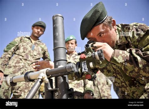 An Afghan National Army Ana Soldier Looks Into A Weapon Sight As He