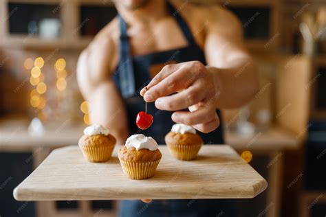 Naked Man In Apron Cooking Dessert On The Kitchen Premium Photo