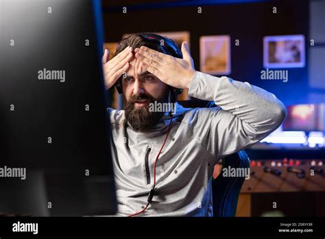 Angry Man Playing Videogames Feeling Headache From Stress After Being Defeated By Enemies