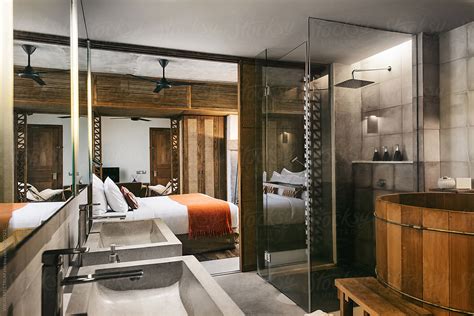 Hotel Bedroom With Attached Bathroom By Stocksy Contributor