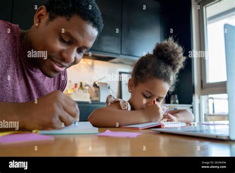 A Father Helping His Babe With Homebabe Stock Photo Alamy