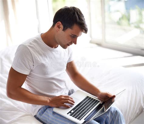 Man Bed And Laptop For Communication Internet And Technology In Bedroom Home And Apartment In