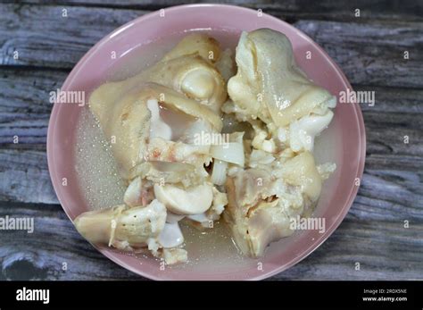 Arabic Egyptian Cuisine Of Kawareh Trotters With Its Traditional Soup