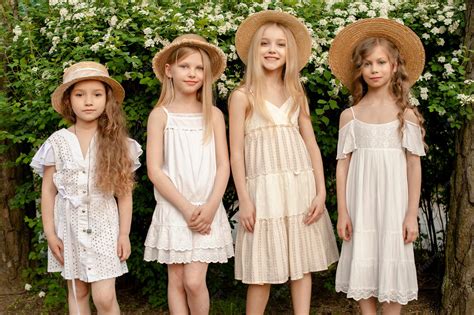 Premium Photo Smiling Tween Girls Standing In Summer Park Near Green