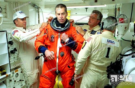 03 08 2001 In The White Room Launch Pad 39b Sts 102 Commander James Wetherbee Gets Help