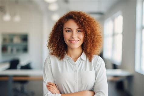 Premium Photo Confident Redhead Businesswoman Smiling In Office