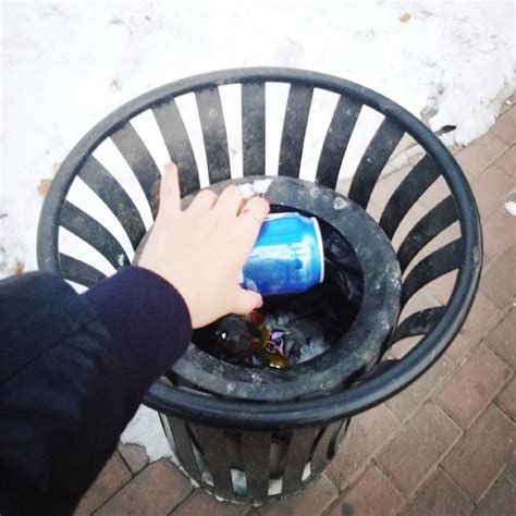 Um Walking Past A Fimiliar Looking Trash Can Being