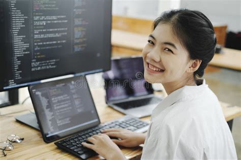 Young Programmer Working On Desktop Pc In Office Of Software Company