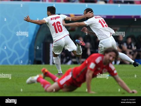 Irans Roozbeh Cheshmi Right Celebrates Scoring Their Sides First Goal Of The Game During The