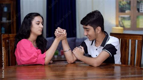 Vídeo Do Stock Cheerful Indian Siblings Doing Arm Wrestling Sibling