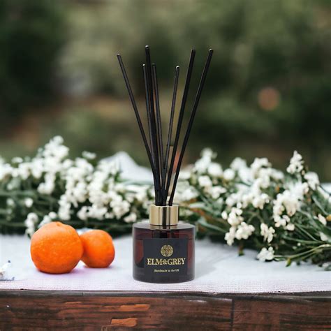 100ml Reed Diffuser Orange Blossom And Juniper In Amber And Gold Coloured Vessel Elm And Grey