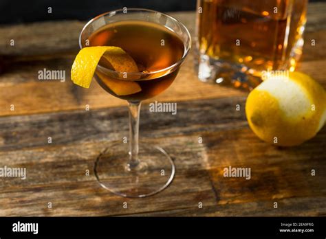 Boozy Alcoholic Scotch Bobby Burns Cocktail With A Lemon Peel Stock Photo Alamy