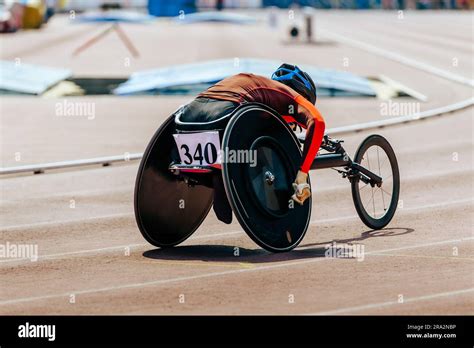 Female Athlete In Wheelchair Racing Track Stadium In Para Athletics
