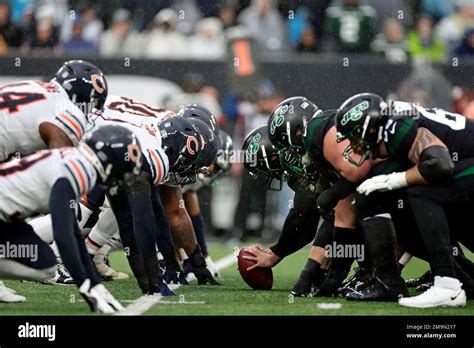 The Chicago Bears And The New York Jets Line Up At The Line Of Scrimmage During An Nfl Football