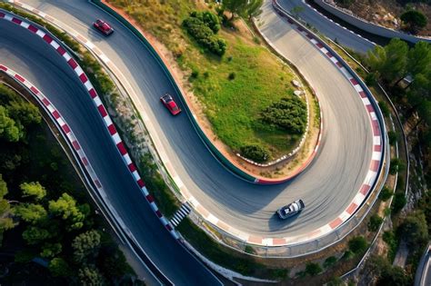 Premium Photo An Overhead Perspective Capturing The Race Track Filled With Speeding Cars In