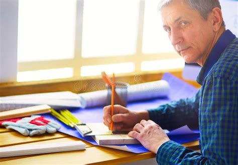 Architect Working On Drawing Table In Office Stock Image Image Of