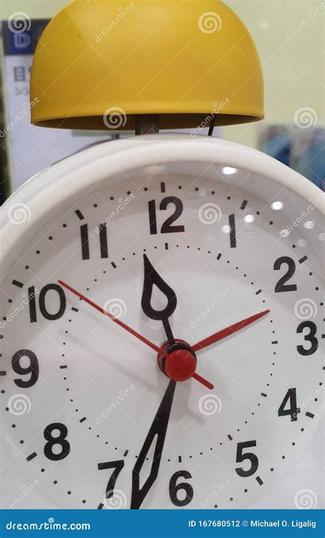 Alarm Clock That Never Stops Ringing Until You Get Up From Bed Stock
