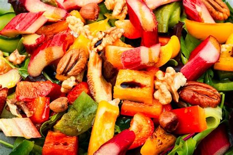 Premium Photo Spring Salad With Rhubarb Greens And Nuts