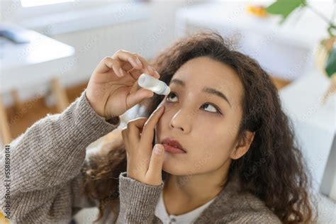 Asian Woman Using Eye Drop Woman Dropping Eye Lubricant To Treat Dry