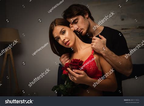 Sensual Woman Red Roses Looking Camera Stock Photo Shutterstock