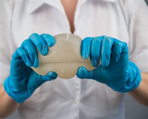 A Plastic Surgeon Demonstrates The Strength Of Silicone Breast Implants