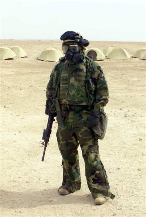 Us Marine In Mopp 4 Gear With M16a2 Rifle During Nbc Drill At Camp