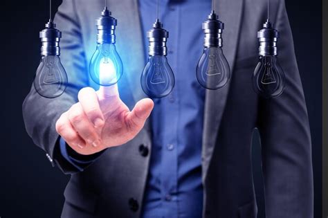 Premium Photo Close Up Of Businessman Hand Pointing At Abstract Glowing Row Of Light Bulbs On
