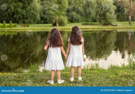 Anonymous Sisters Standing Near Lake Stock Image Image Of Friendship