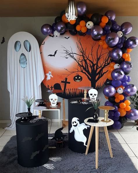 Halloween Decorations And Balloons Are On Display In The Living Room