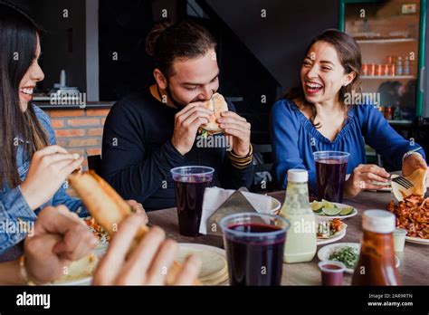 Man In Leather Mask Eating A Taco At Logan Brewis Blog