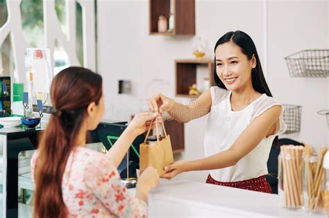 Shop Assistant Giving Order To Customer Stock Image Image Of Standing
