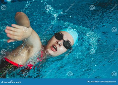 A Young Swimmer Performs A Forward Crawl Technique The Theme Of Sports