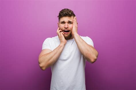 Premium Photo Young Handsome Caucasian Man Whining And Crying