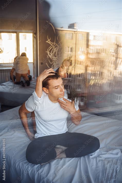 Reflection In Glass In A Mirror Hot Couple In Love Man And Woman Slowly Undress Each Other