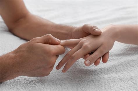 Premium Photo Woman Receiving Hand Massage On Soft Towel Closeup