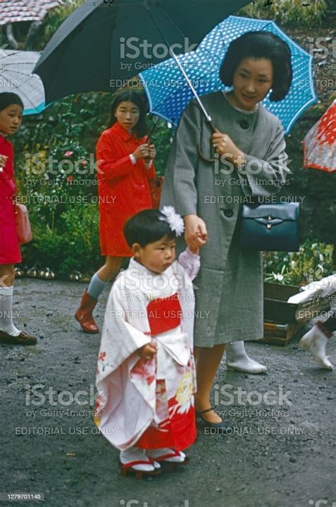 Japanese Mother With Her Son On The Grounds Of A Shinto Shrine Stock
