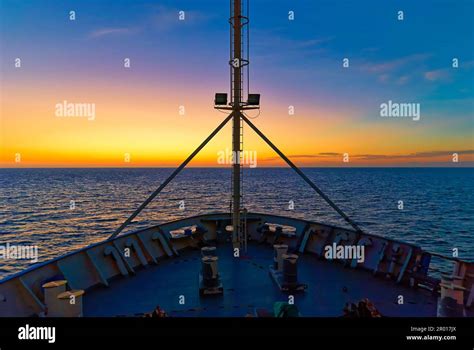 A Seismic Vessel Heading East At Dawn With The Sun About To Rise