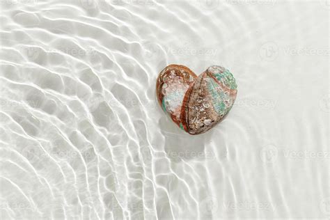 Shiny Shells Of Abalone As Heart With Waves Sea Water Textured