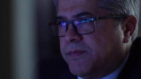 The Software Code Reflected In The Glasses The Software Codes Are Reflected On The Glasses