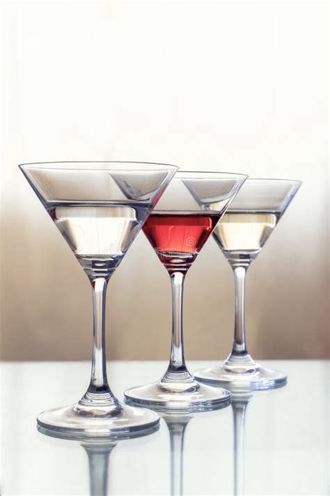 Three Cocktail Glasses With Beautiful Triangular Glasses Concept For Advertising Alcoholic