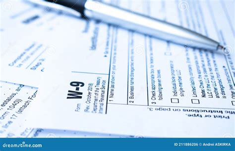 Form W 9 Request For Taxpayer Identification Number And Certification With Pen Editorial Photo