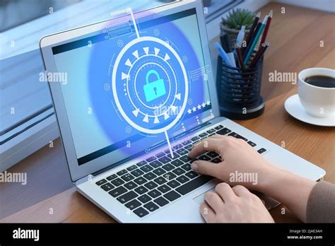 Woman Using Laptop With Blocked Screen At Table Concept Of Online Safety Stock Photo Alamy