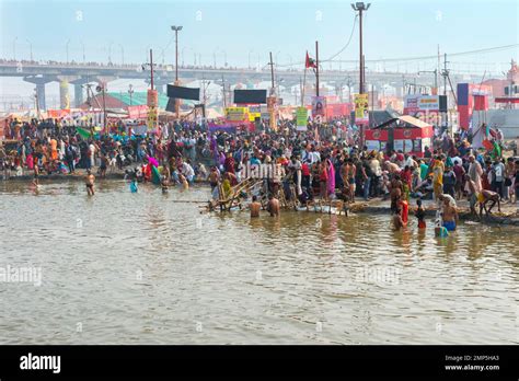 Pilgrims Waiting To Enter The Ganges River For The Ritual Bathing