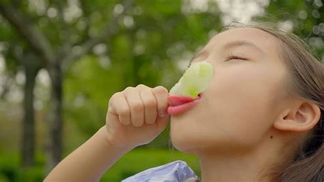 Girl Sucking Popsicle