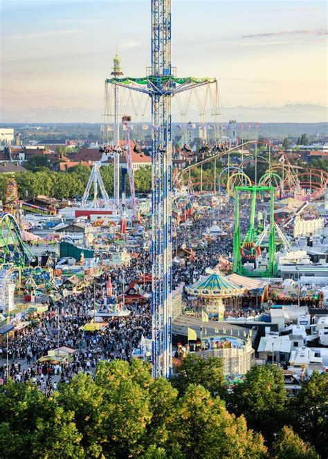 Panorama Munich Oktoberfest With Visitors Rides And Marquees Munich