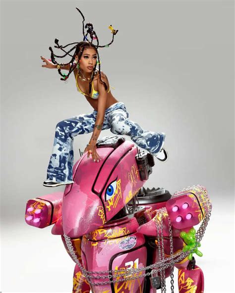 Download Free Coi Leray Shines In Her Iconic Outfit Wallpaper