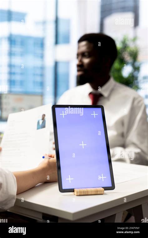 Hr Specialist Using Isolated Screen Tablet To Reviewing Candidate Cv Asking Questions About