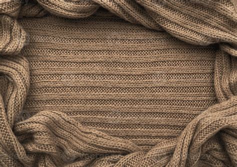Oval Frame For Text From Brown Knitted Scarf Or Sweater Texture Top