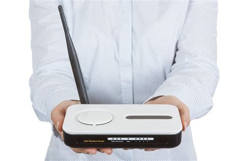 Premium Photo Wireless Modem Router Hardware In Woman Hands On A White Background