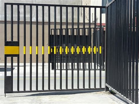 Premium Photo Open Gate Against Buildings